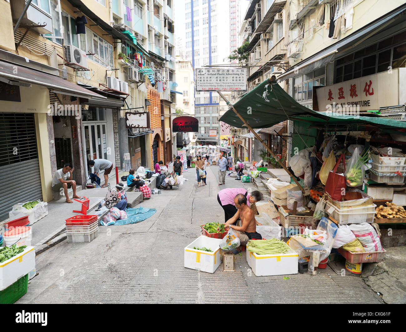 Vendors selling goods and produce at an outdoor market in Central Stock ...