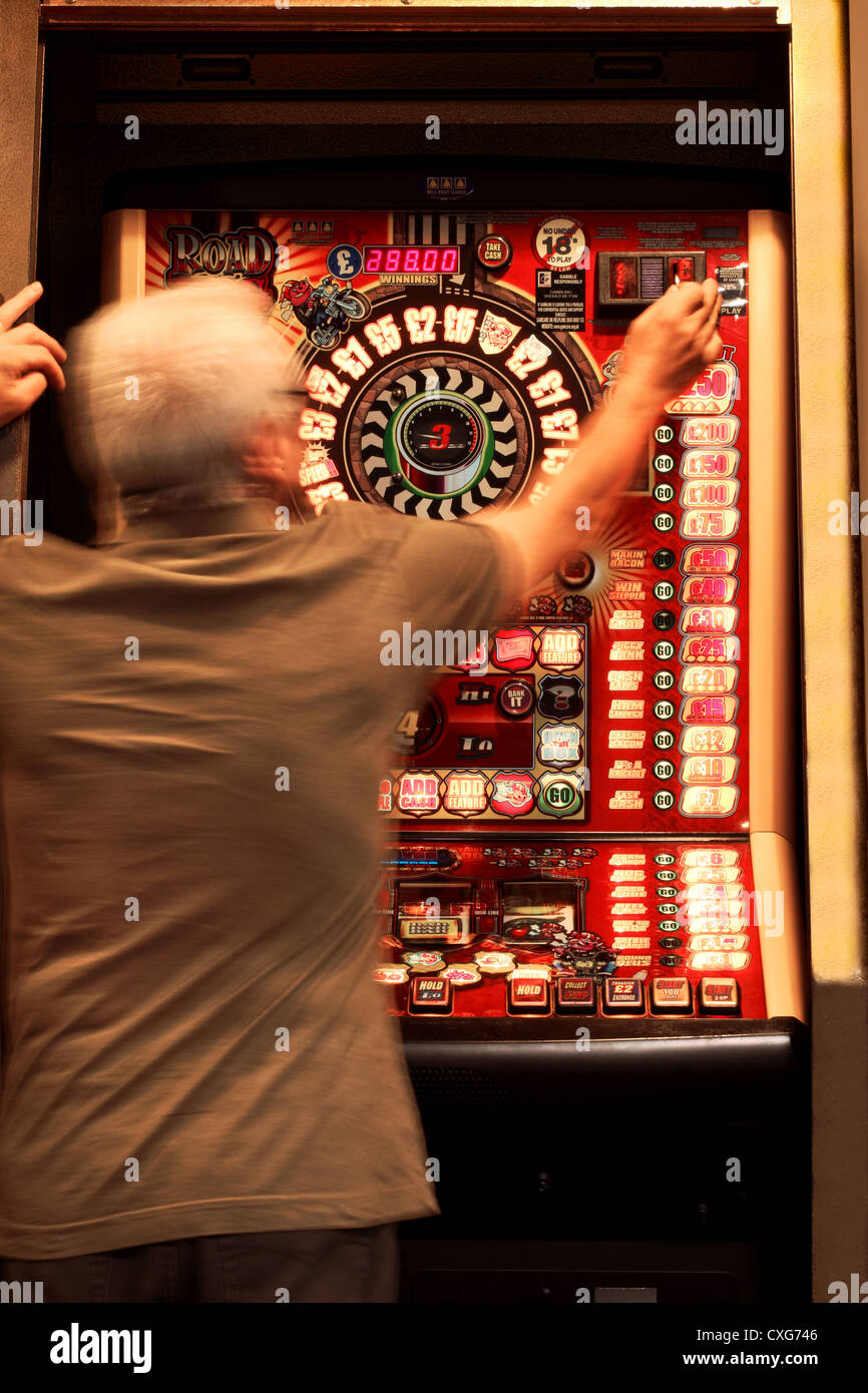 A man approximately 60 years old, (showing slight movement) placing a ...
