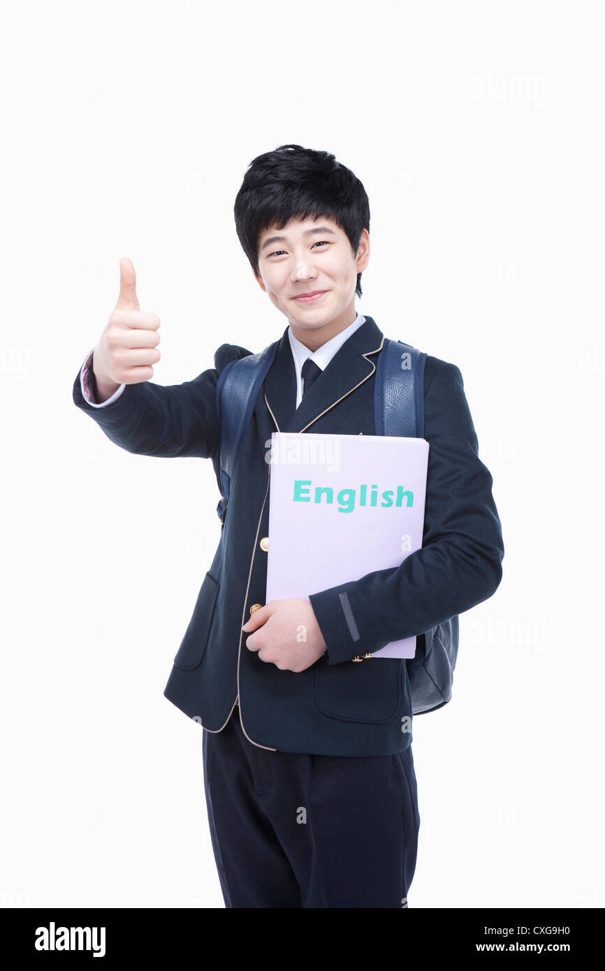 schoolboy holding a folder and giving a thumbs-up Stock Photo - Alamy