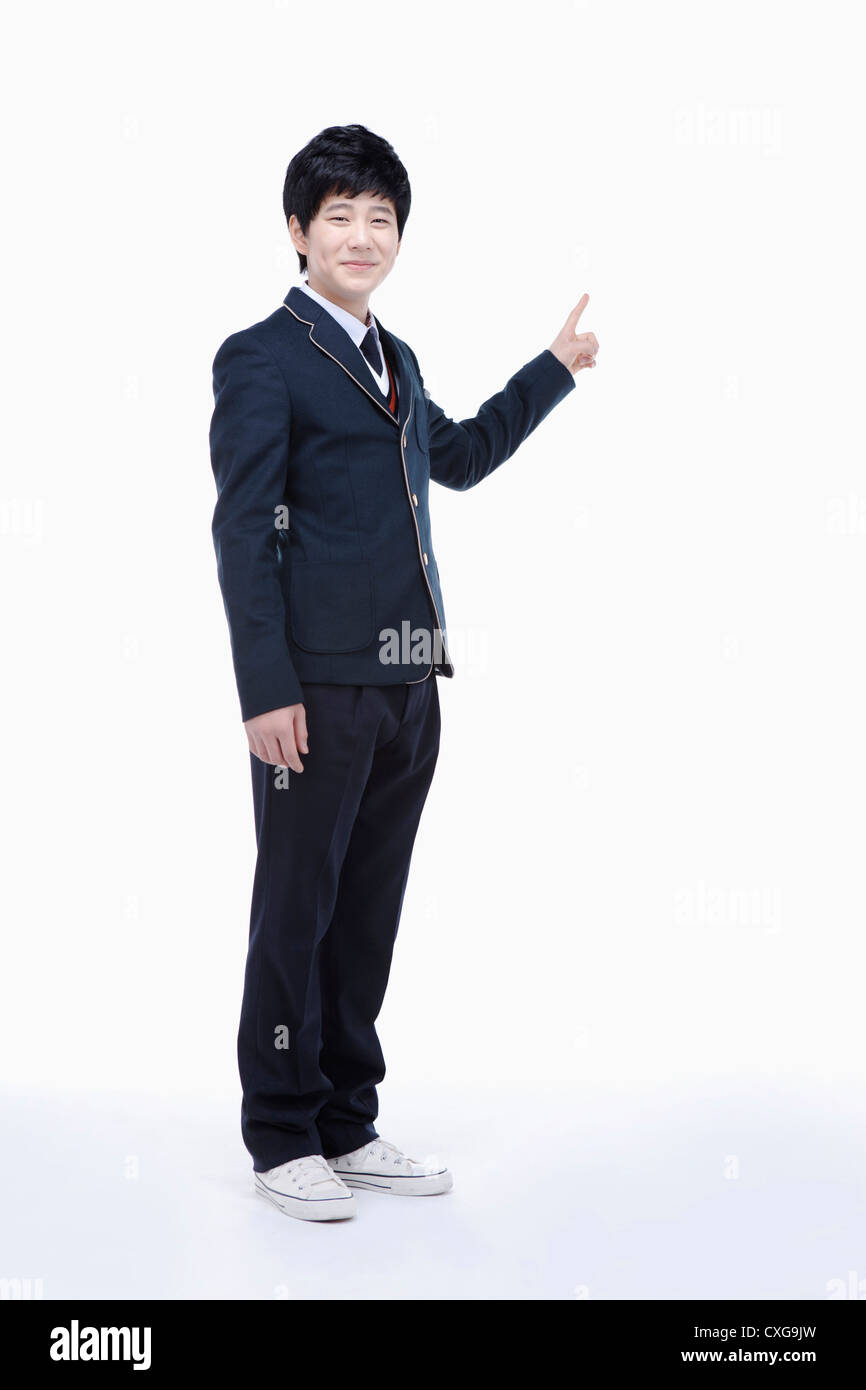 schoolboy pointing out with his index finger Stock Photo - Alamy