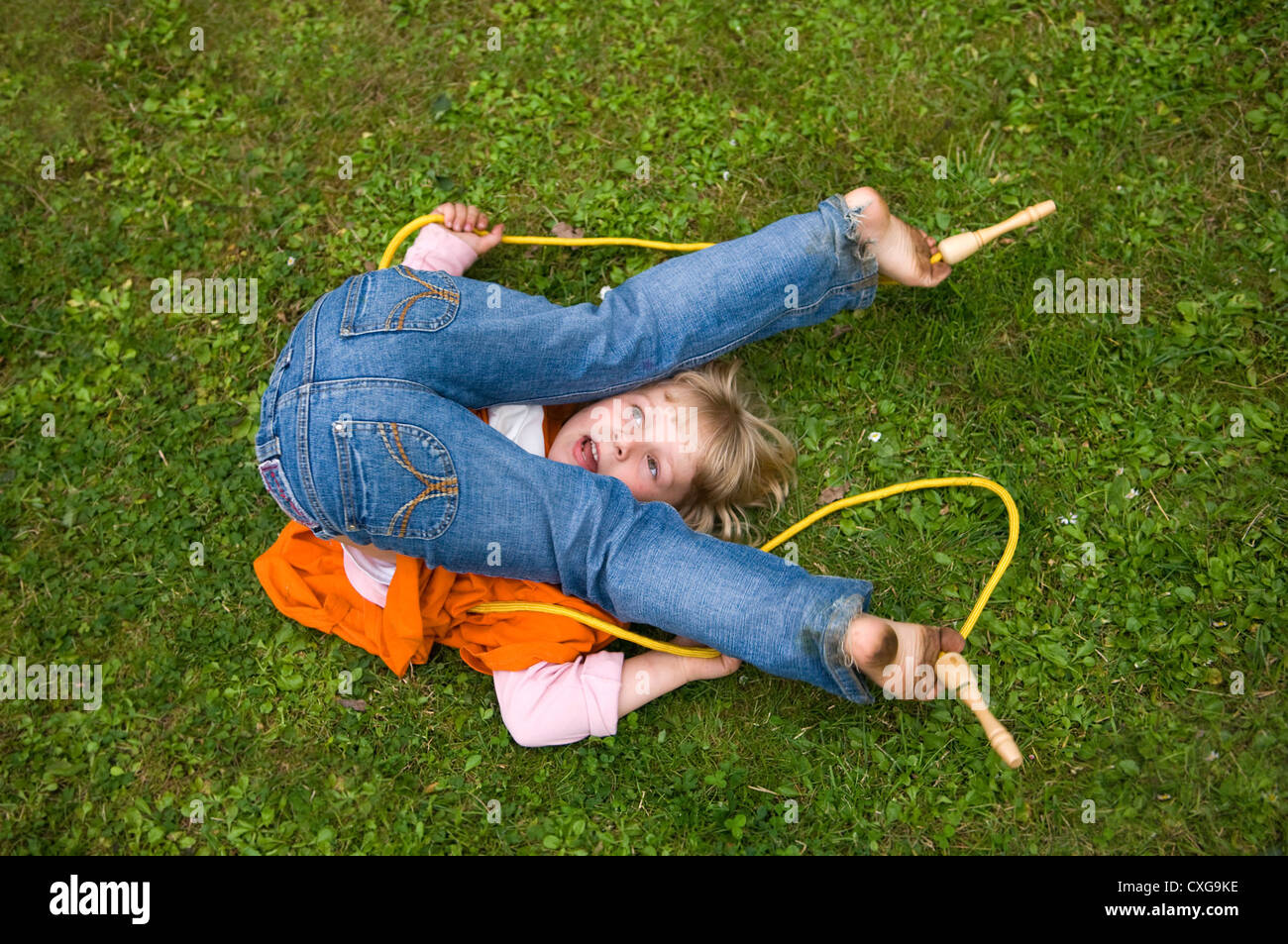 Girl playing with a jump rope hi-res stock photography and images - Alamy