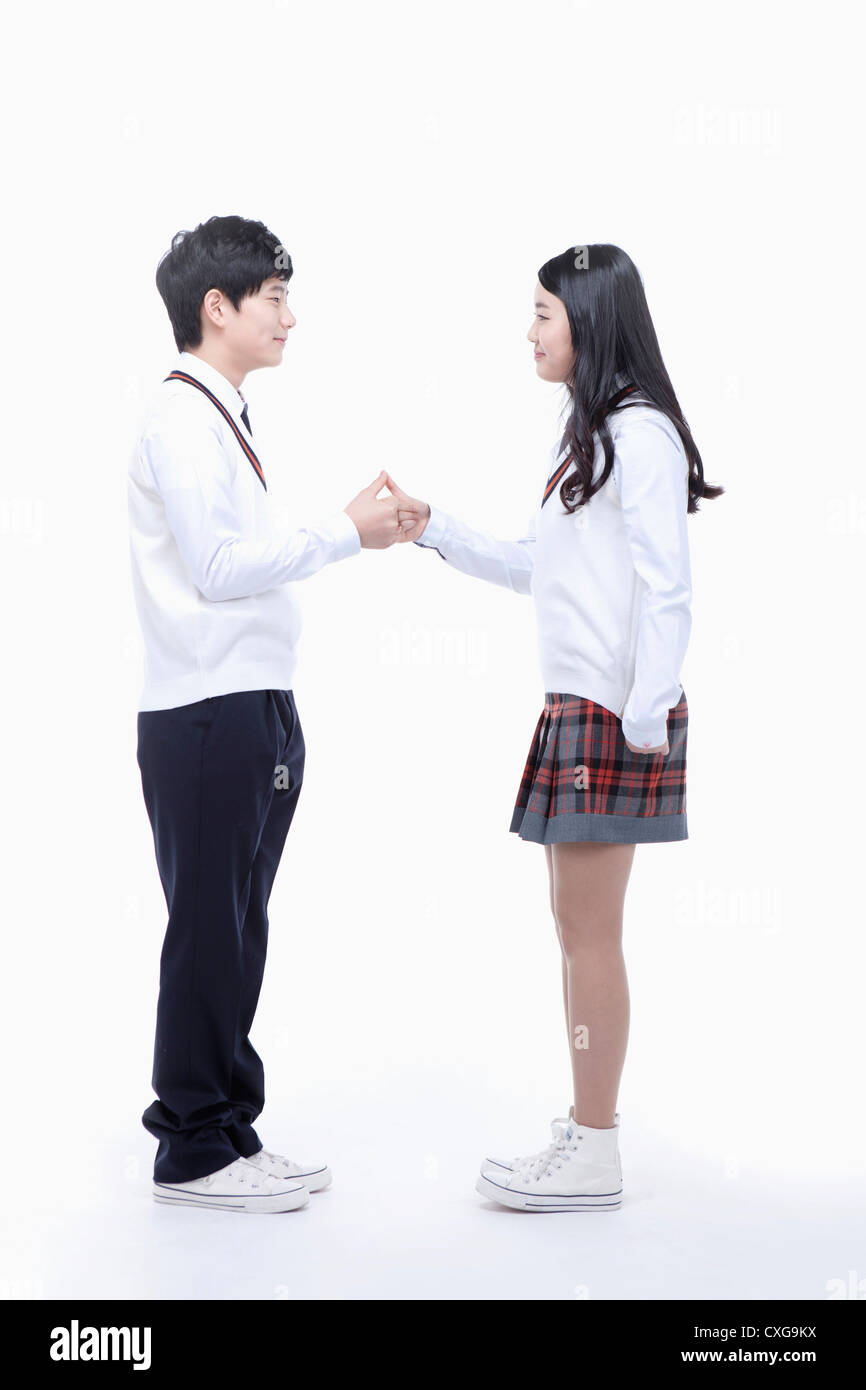 students pinkie-swearing each other Stock Photo - Alamy