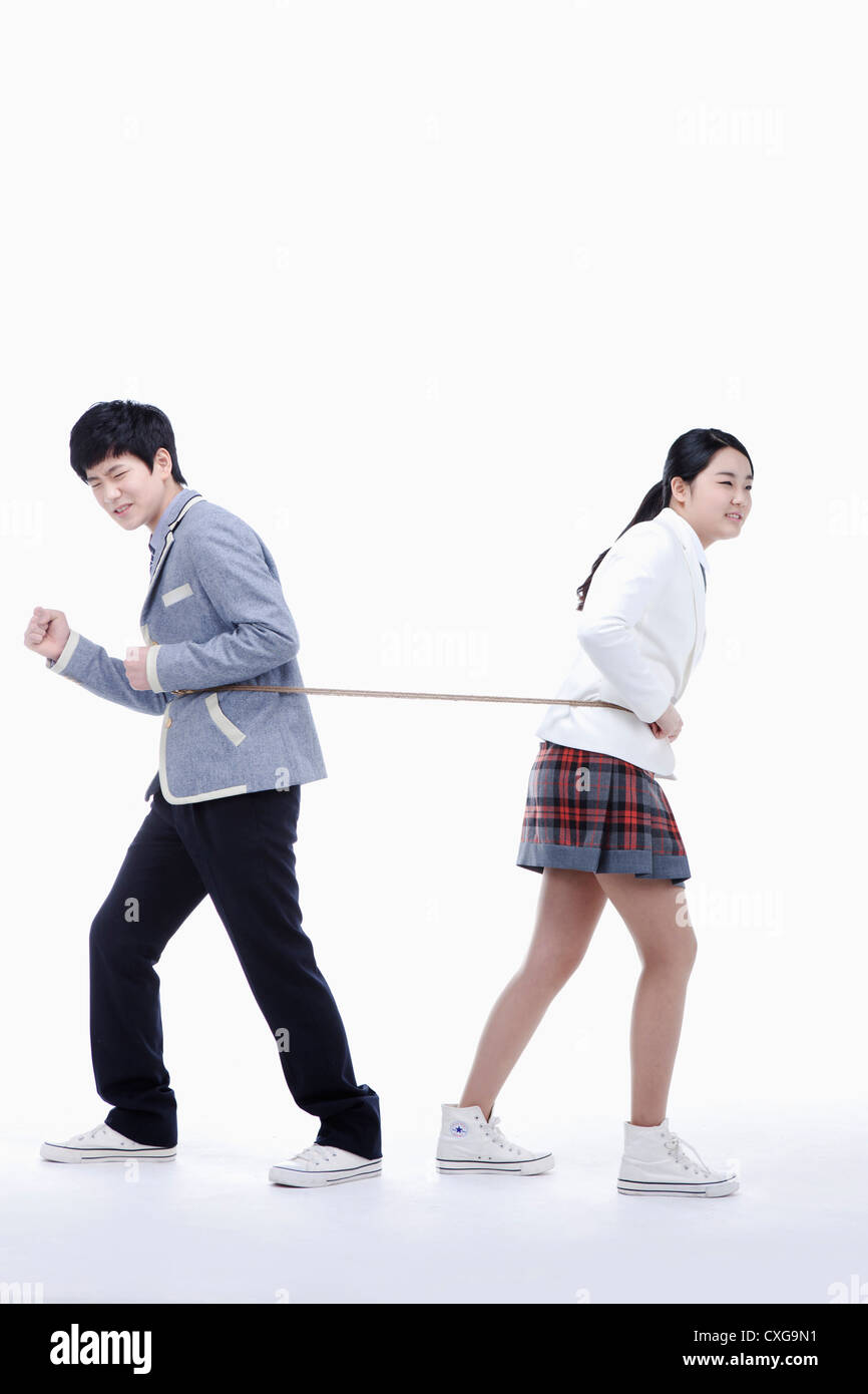 students pulling a string toward opposite side each other Stock Photo ...