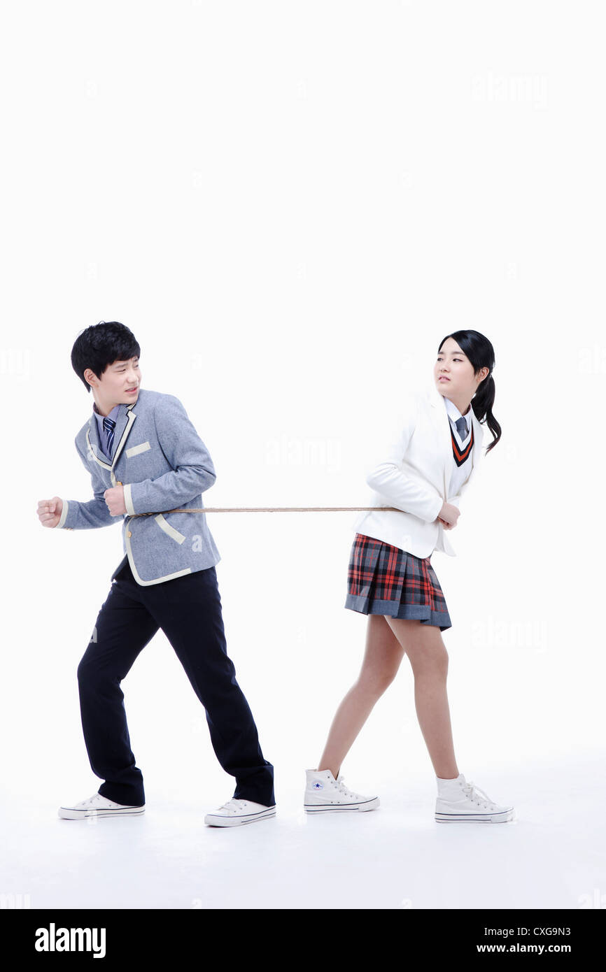 students pulling a string toward opposite side each other Stock Photo ...