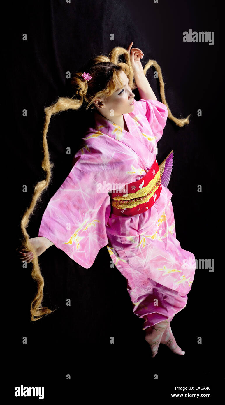 Beauty woman lay in kimono cosplay character Stock Photo - Alamy