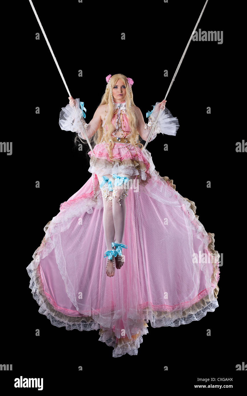 Pretty girl in fary-tale doll costume fly Stock Photo - Alamy