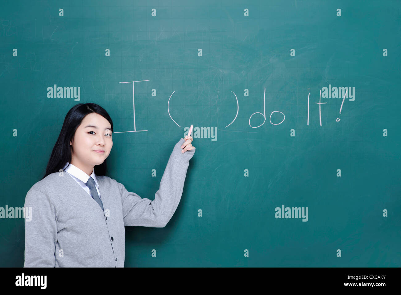 schoolgirl pointing out the bracket on the blackboard Stock Photo - Alamy