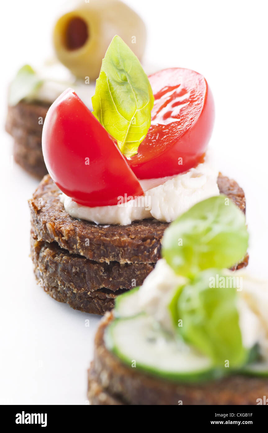 Canapes with tomato and feta Stock Photo - Alamy