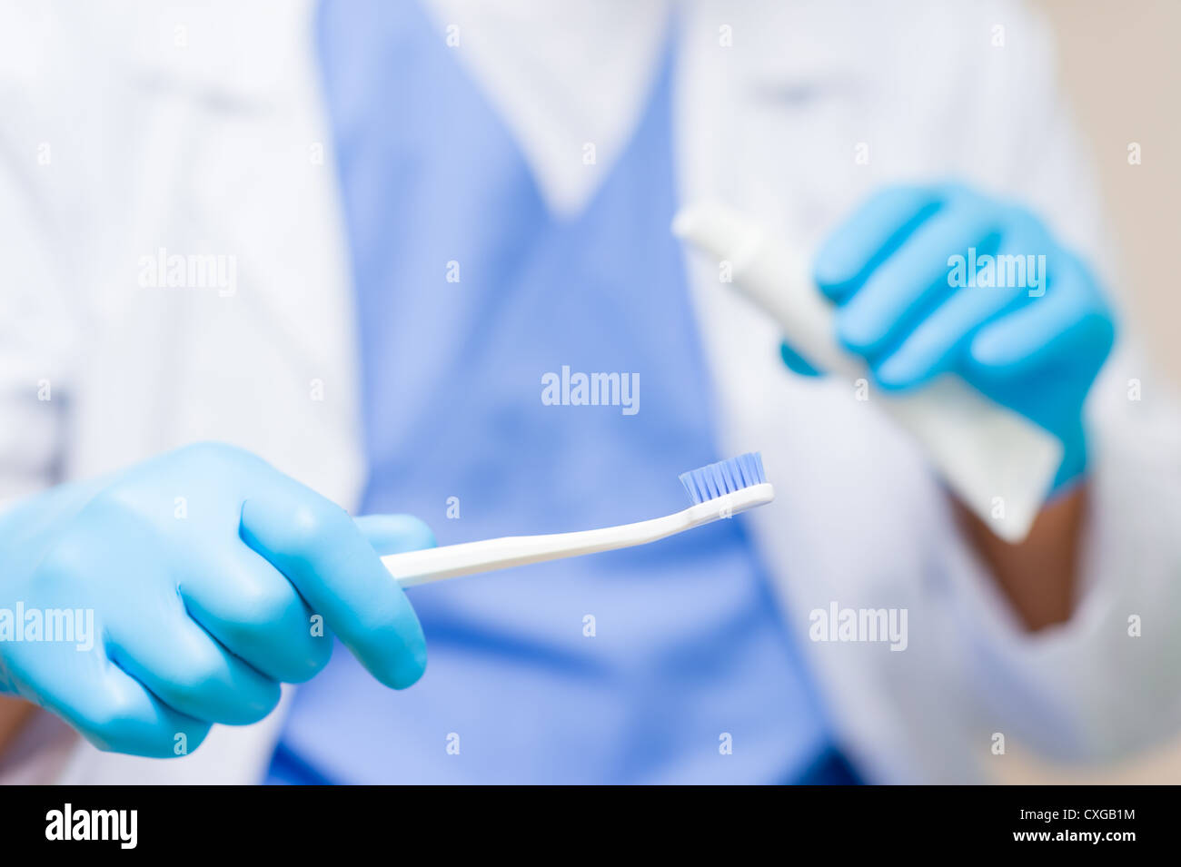 Dental hygiene surgeon hold toothbrush and toothpaste close-up Stock ...