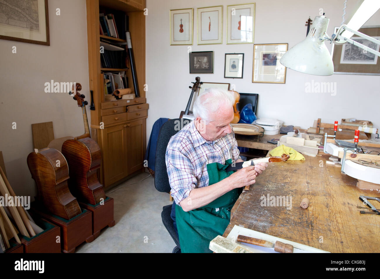 Reiner Schumman restores a violin in the workshop at John & Arthur ...