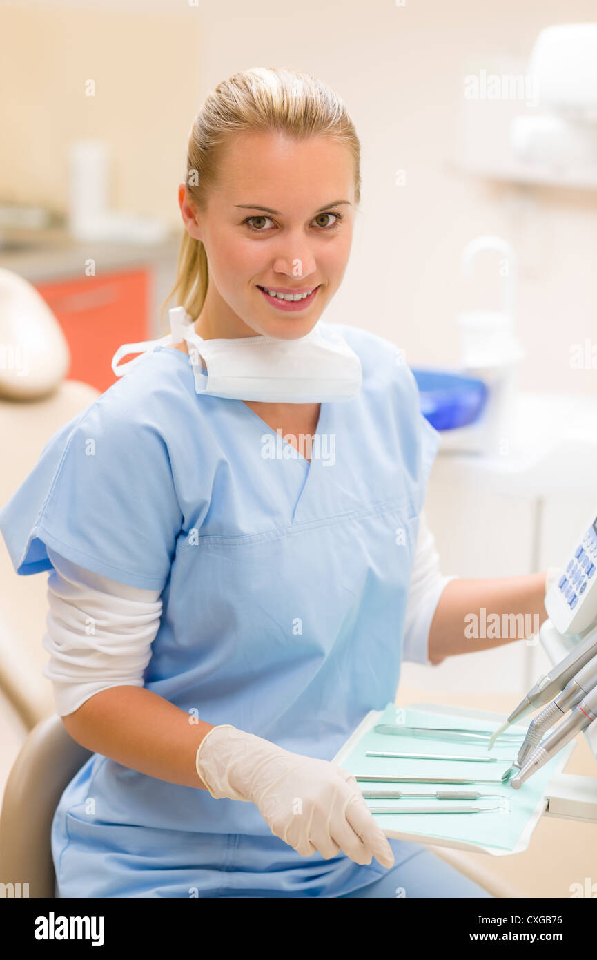 Professional dental staff with medical tools sitting at surgery office ...