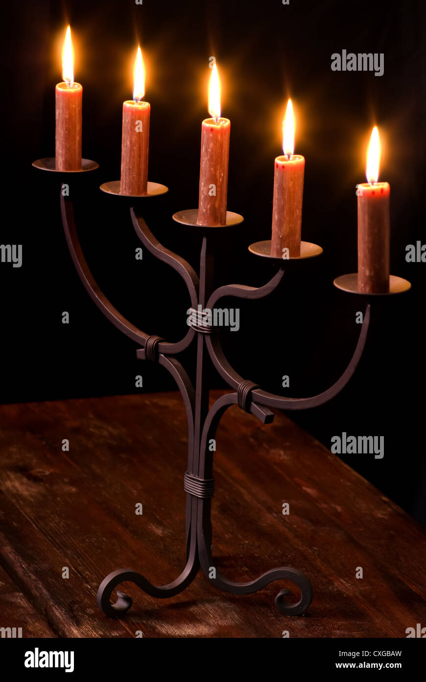 Candlelight holder on old teak table Stock Photo - Alamy