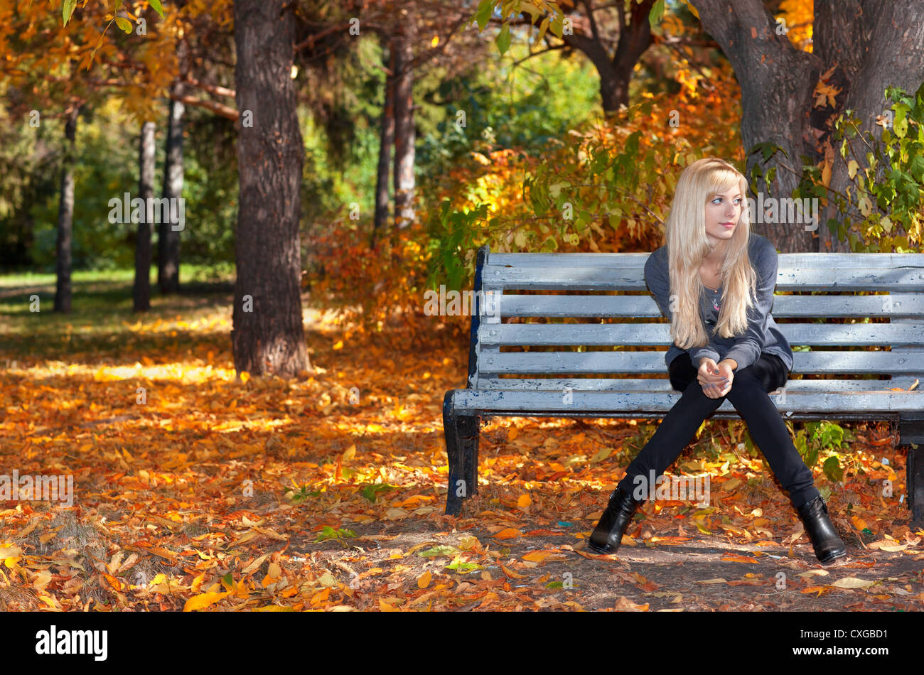 girl on a bench in park Stock Photo - Alamy