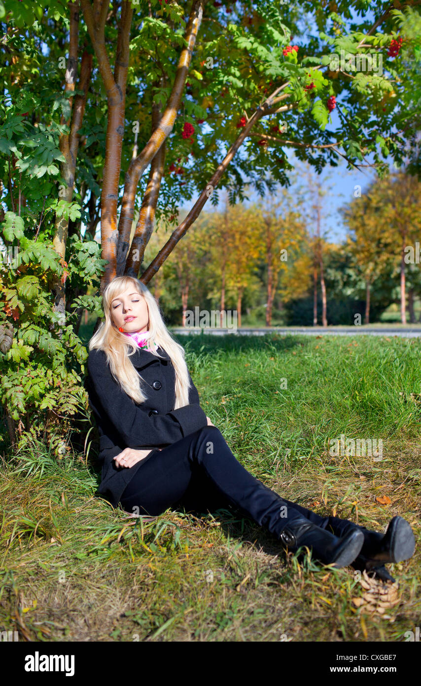 Woman under mountain ash tree Stock Photo - Alamy