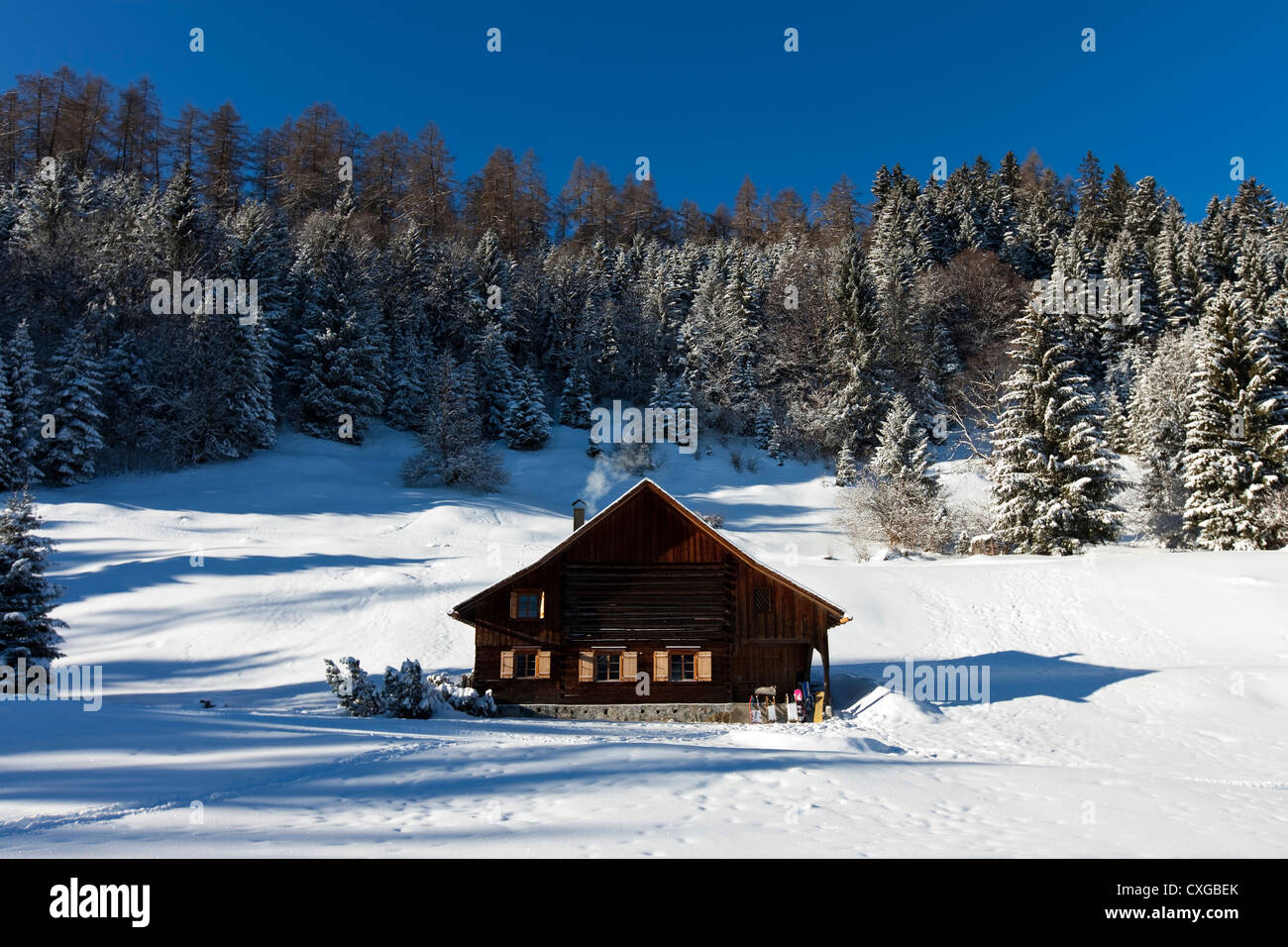 Rural sunny winter landscape with occupied chalet Stock Photo - Alamy