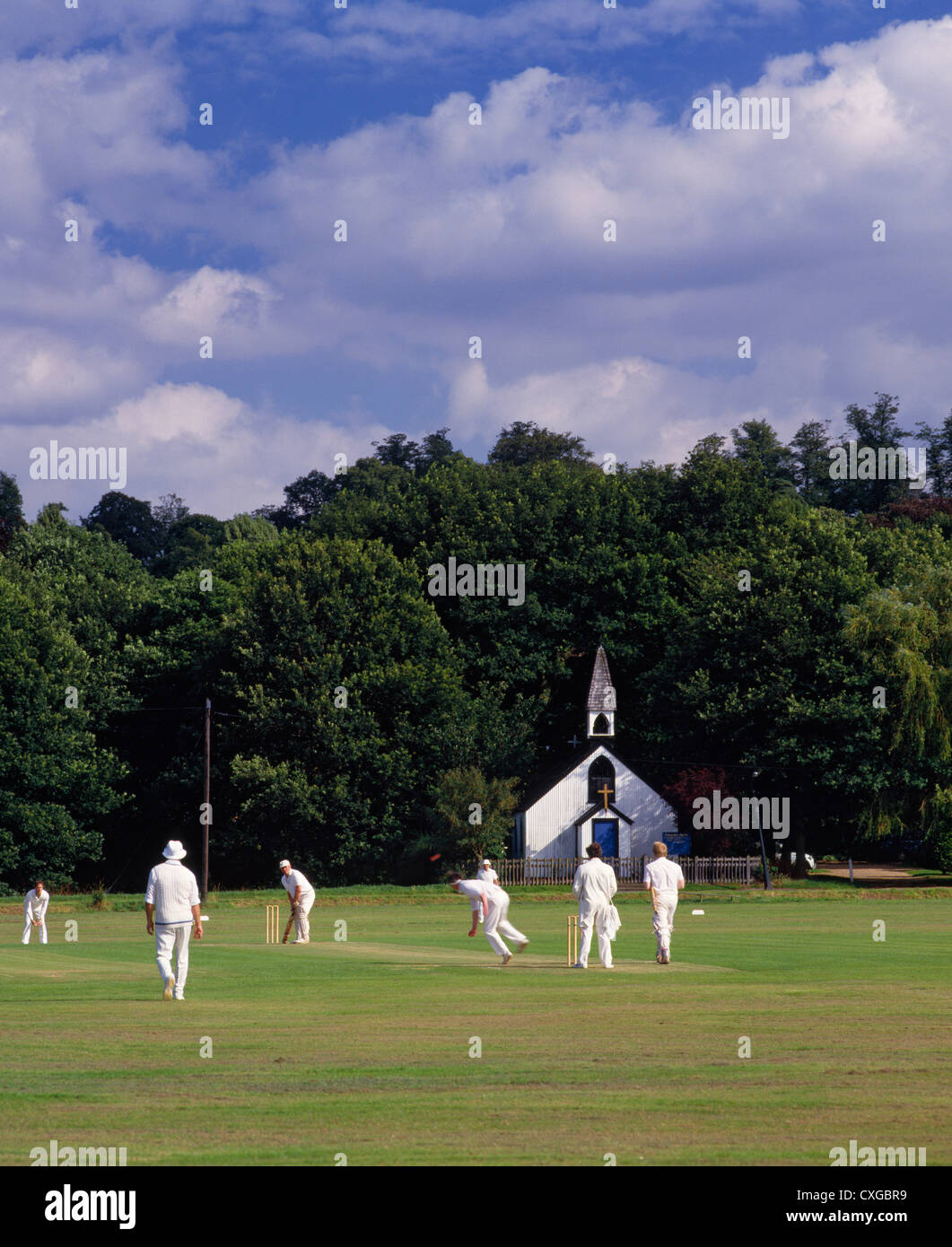 Cricket on the village green with St.George's Church beyond. West End ...