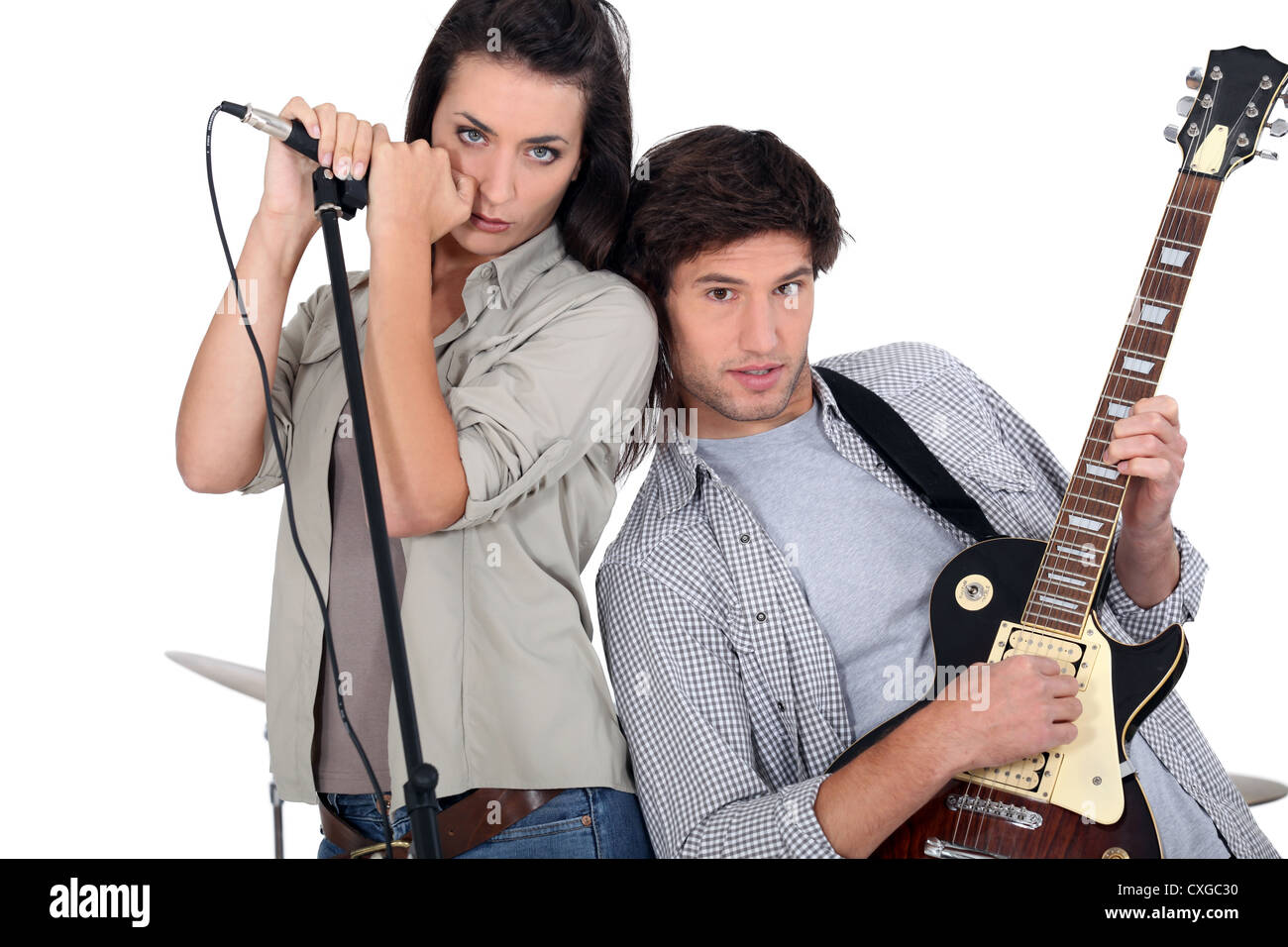 Couple rocking in a band Stock Photo - Alamy