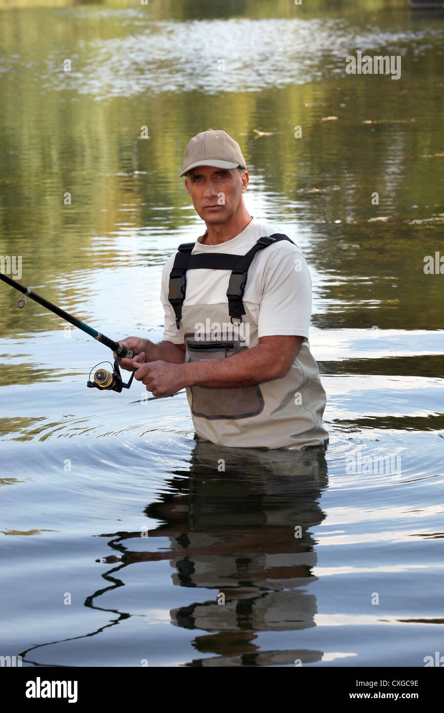 Man fishing in the river Stock Photo - Alamy