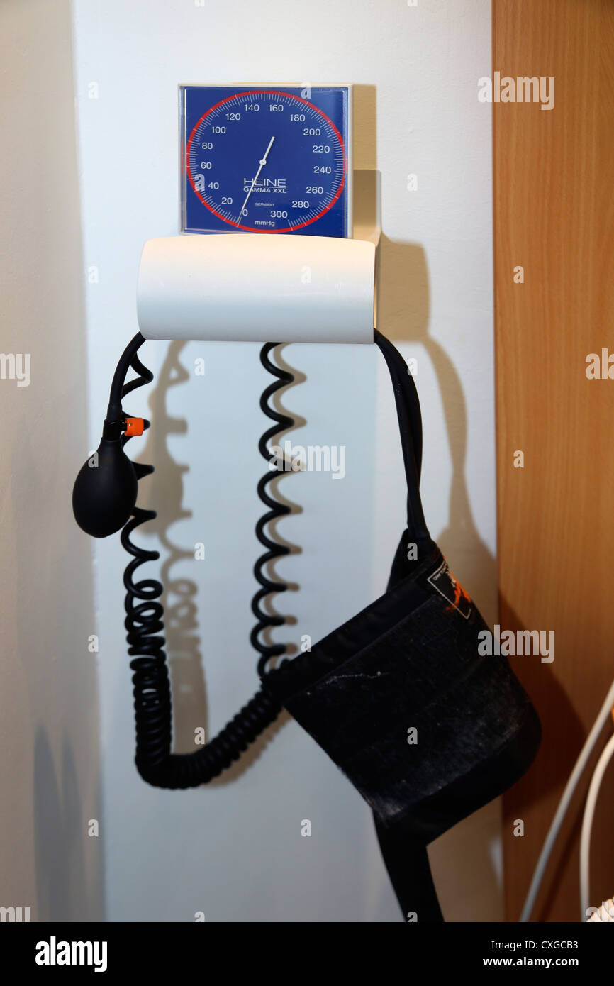 Blood Pressure Monitor On Wall In Hospital Ashtead Surrey England Stock ...