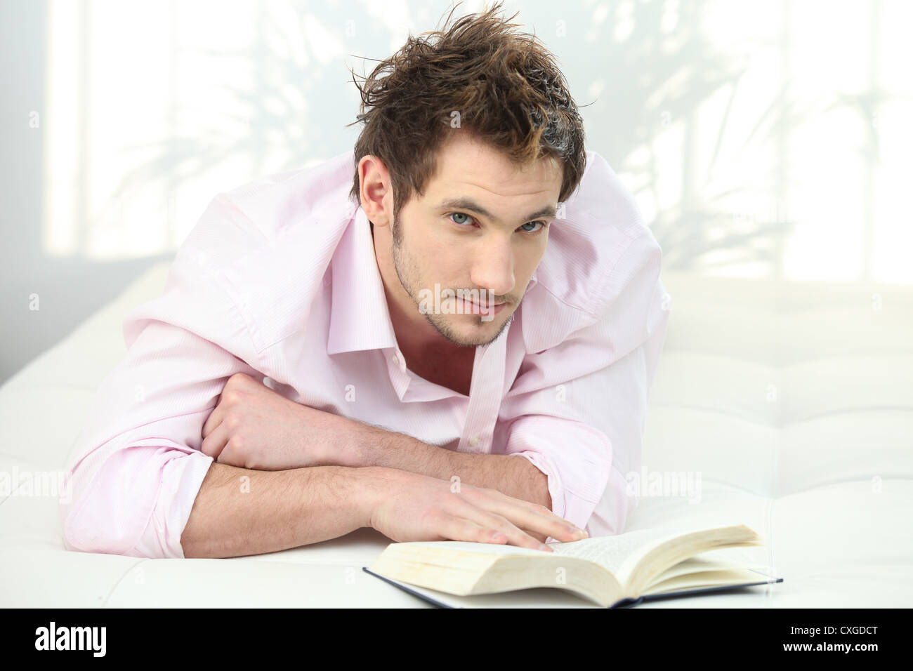 Man reading a book Stock Photo - Alamy
