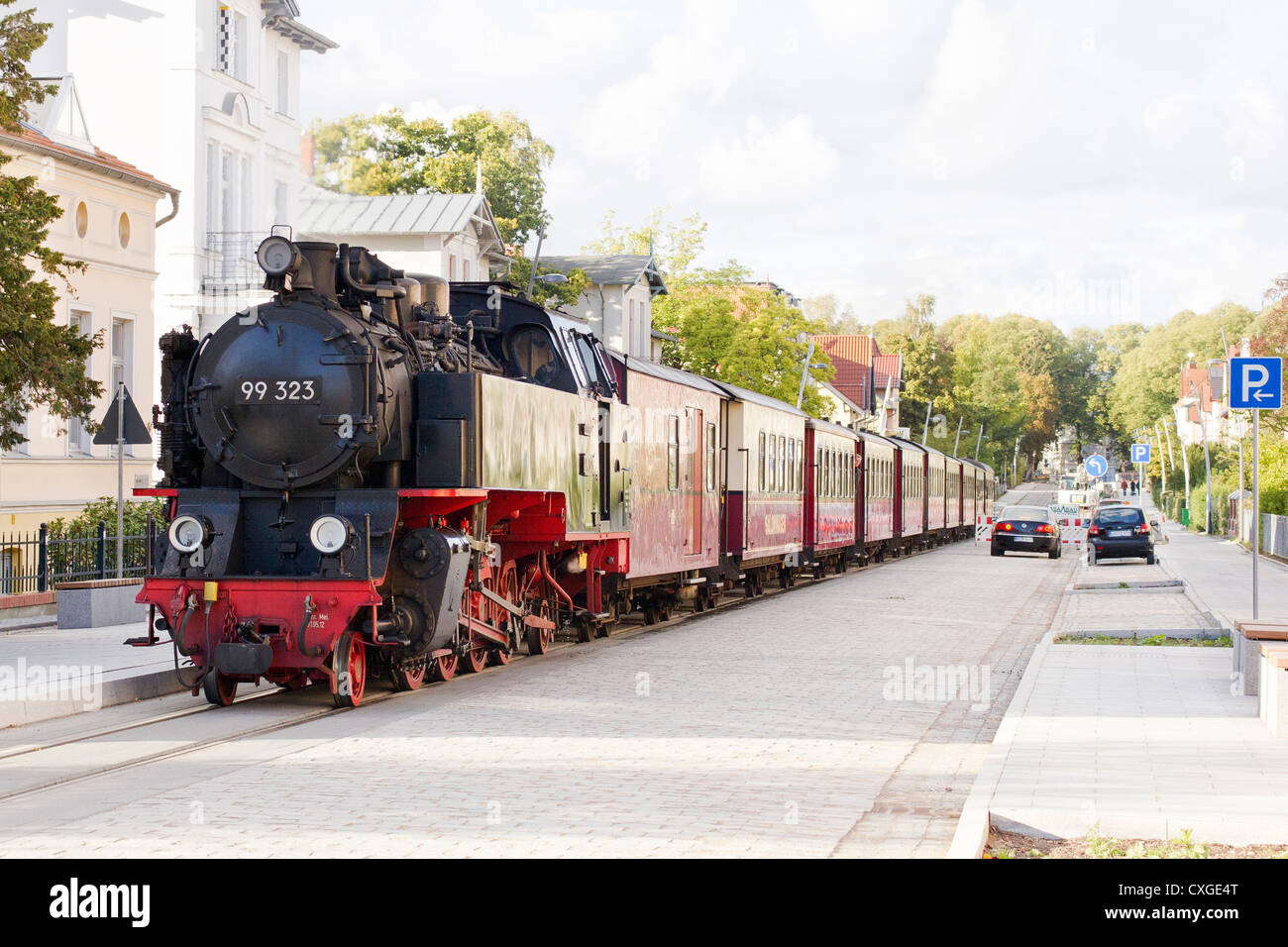 Steam locomotive pulling a passenger train. The Molli bahn at Bad ...