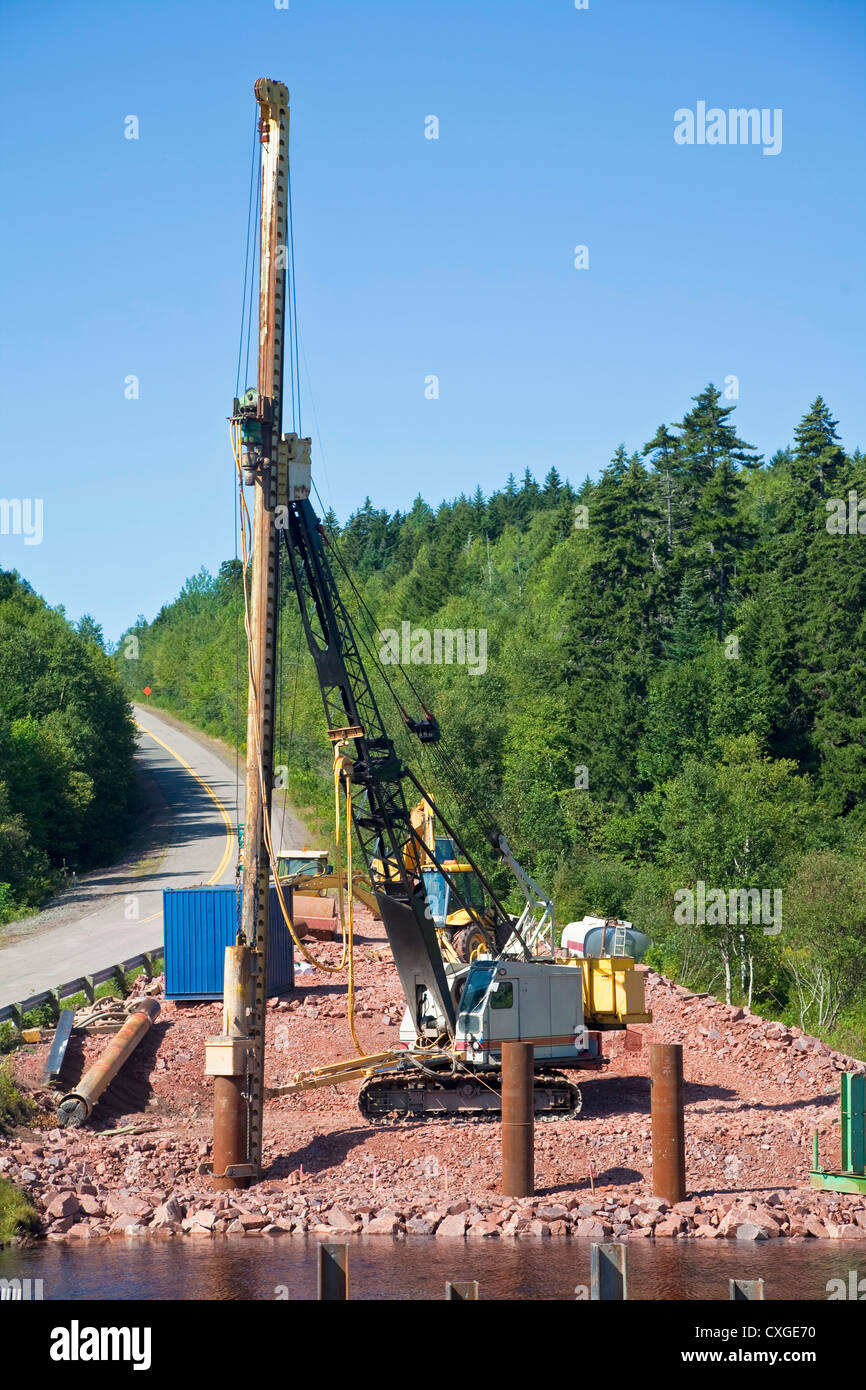 Equipment used to drive bridge pylons in construction of a new bridge ...