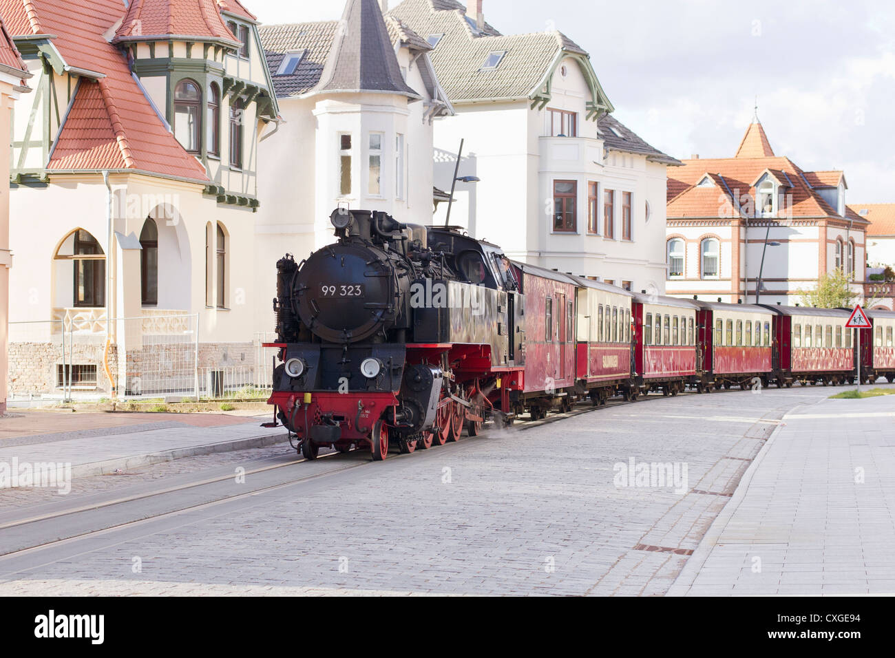 Steam locomotive pulling a passenger train. The Molli bahn at Bad ...