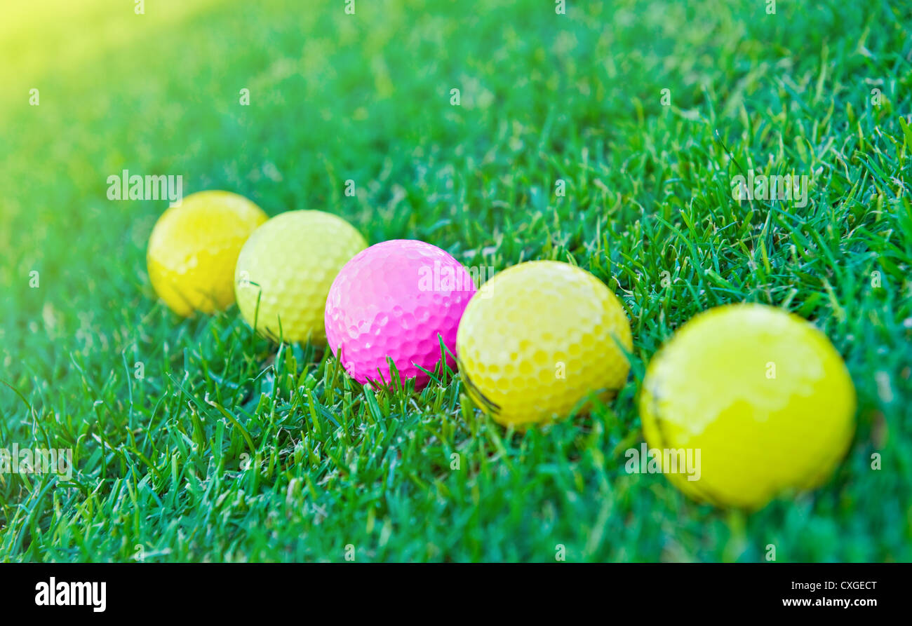 Four golf balls Stock Photo - Alamy