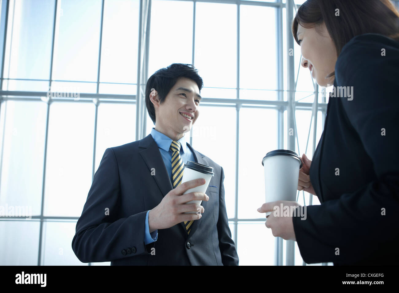Business people drinking coffee talking hi-res stock photography and ...