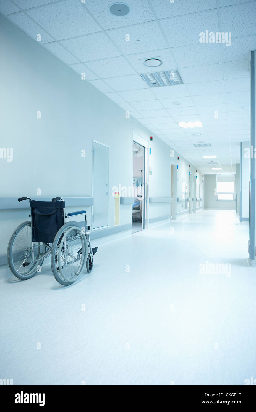 A picture of a wheelchair in hospital corridor Stock Photo - Alamy