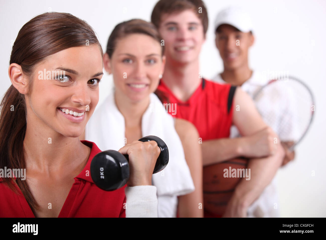 Four young people and their preferred forms of exercise Stock Photo - Alamy