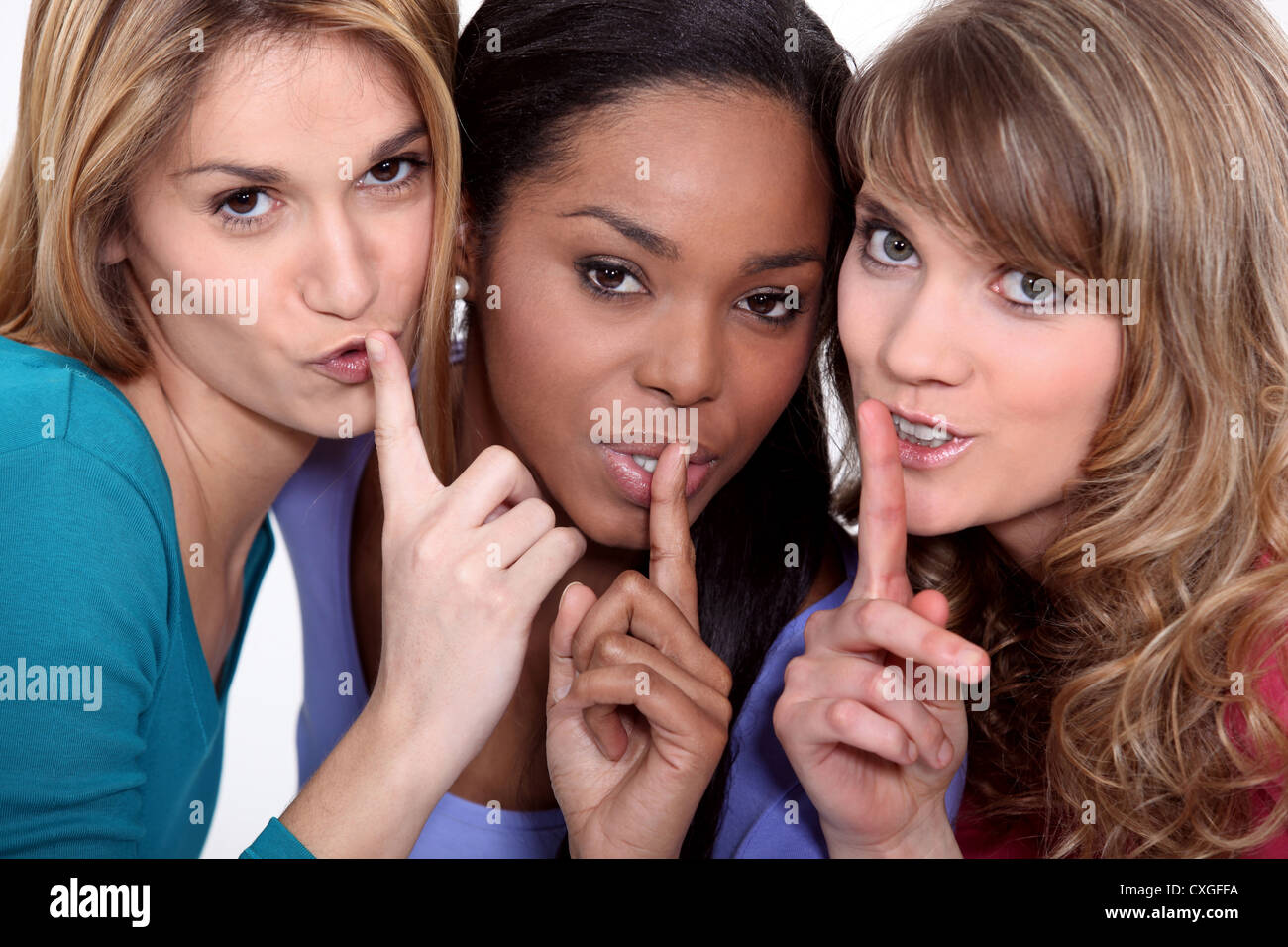 Friends with a secret Stock Photo - Alamy
