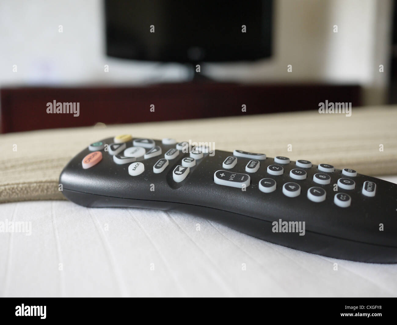 tv remote on bed Stock Photo - Alamy