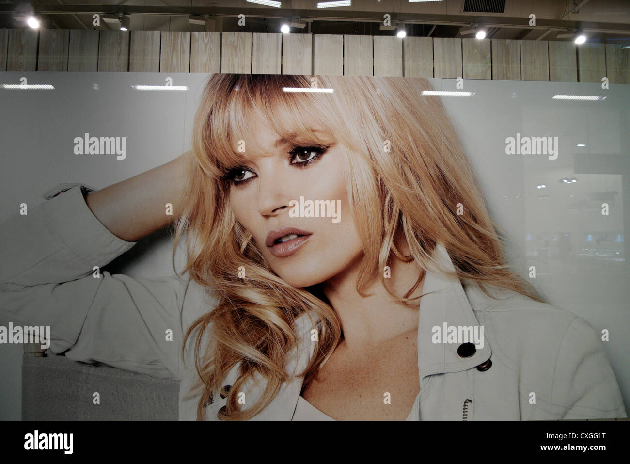 A poster of fashion model Kate Moss in a shop window in One New Change ...