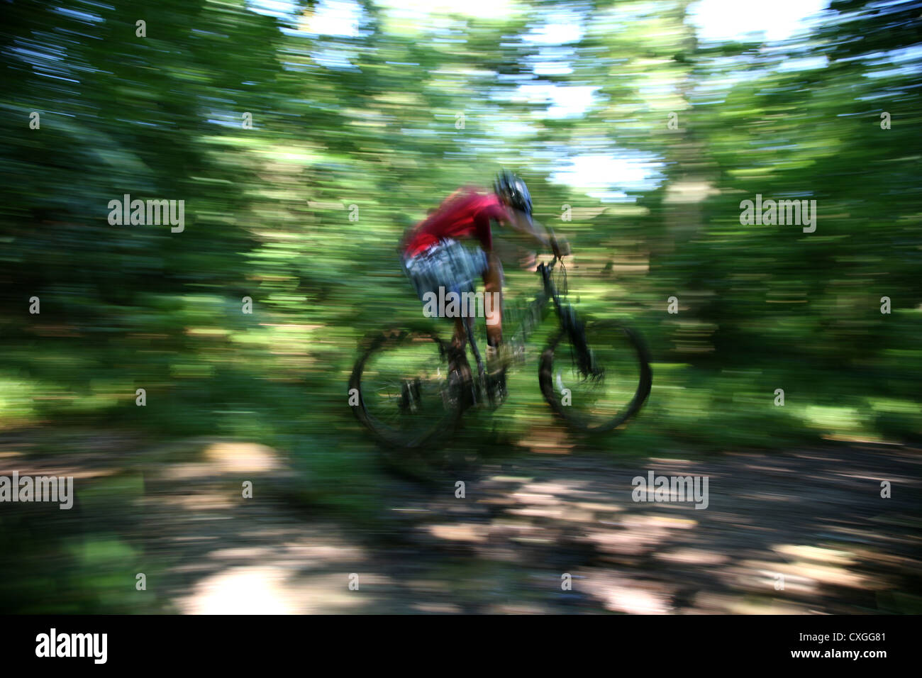 Boy speeding on bike Stock Photo - Alamy