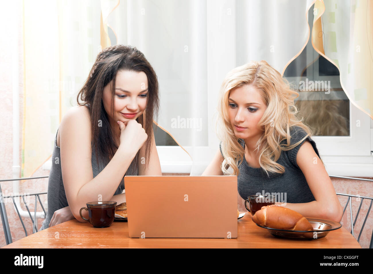 girls at the table Stock Photo - Alamy
