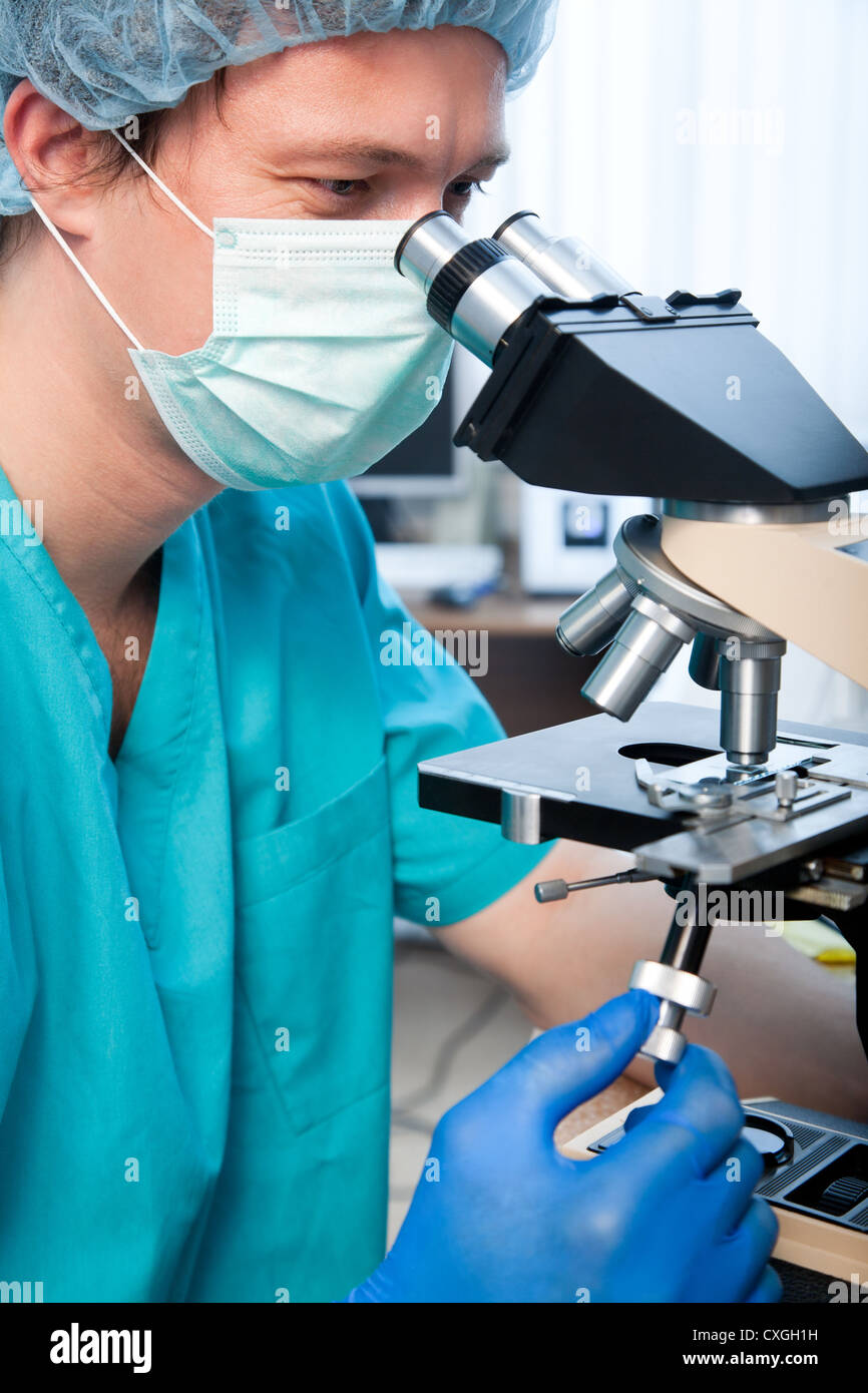researcher with microscope Stock Photo - Alamy