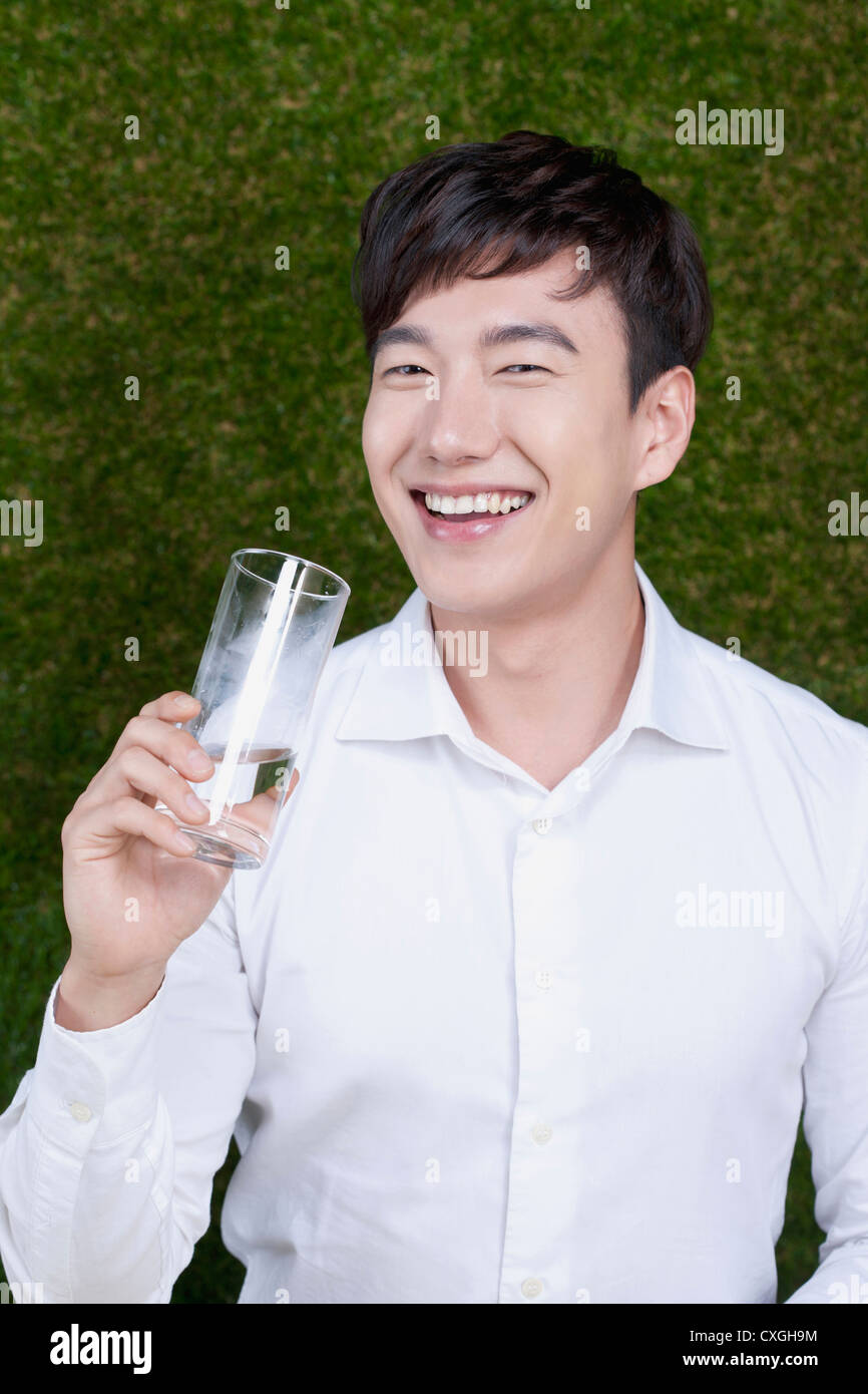 man drinking a glass of water Stock Photo - Alamy