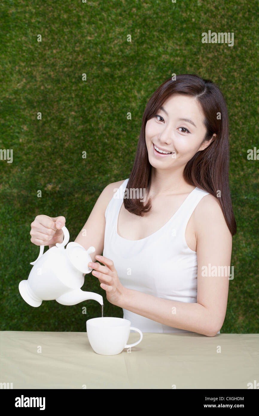 woman pouring tea Stock Photo - Alamy