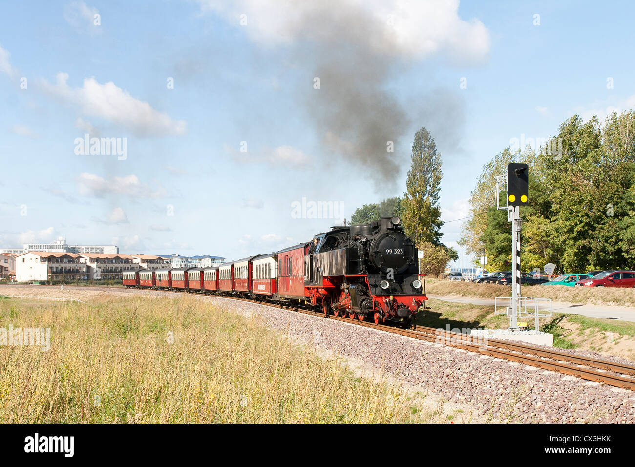Steam locomotive pulling a passenger train. The Molli bahn at Bad ...