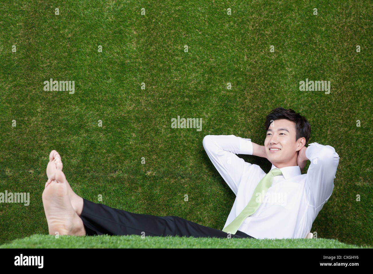 man sitting and leaning against the chair Stock Photo - Alamy