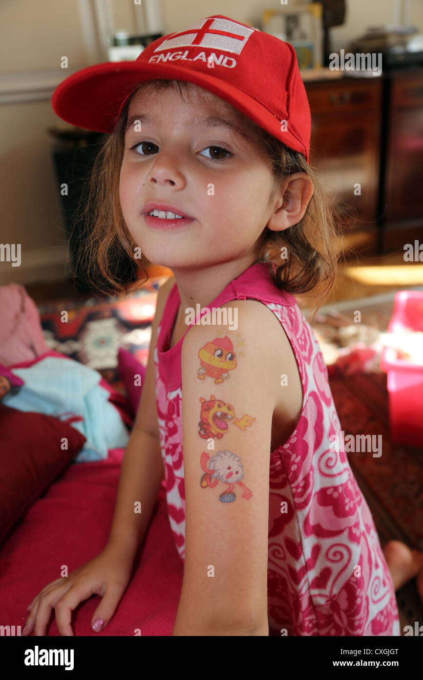 Young Girl With Water Transfer Tattoos On Her Arm And England Baseball ...