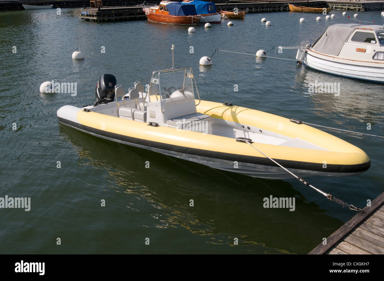 speed boat boats rib ribbed inflatable dingy mored mooring tied up ...