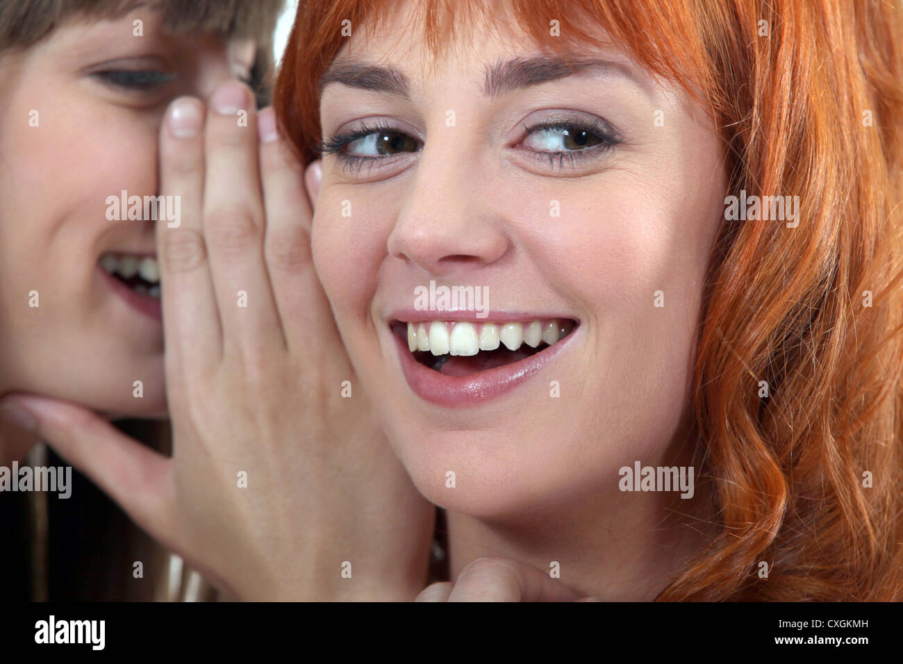 Telling a secret hi-res stock photography and images - Alamy