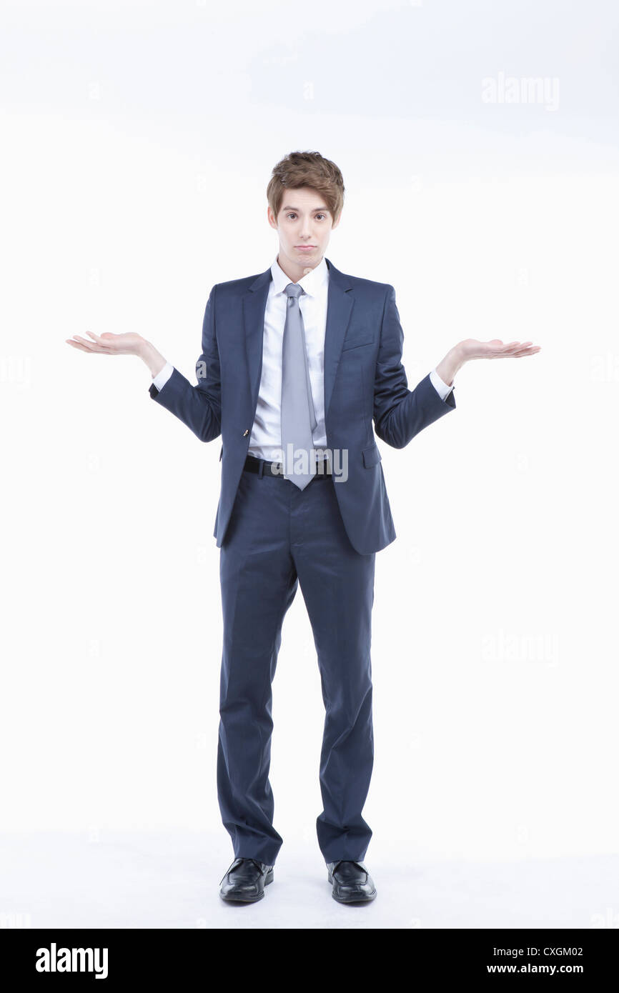 businessman shrugging with embarrassment Stock Photo - Alamy