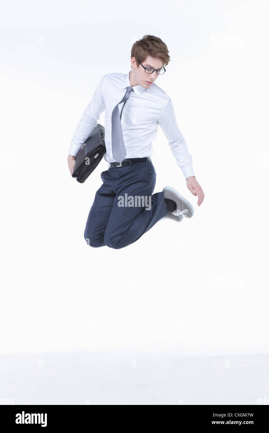 businessman jumping into the air Stock Photo - Alamy