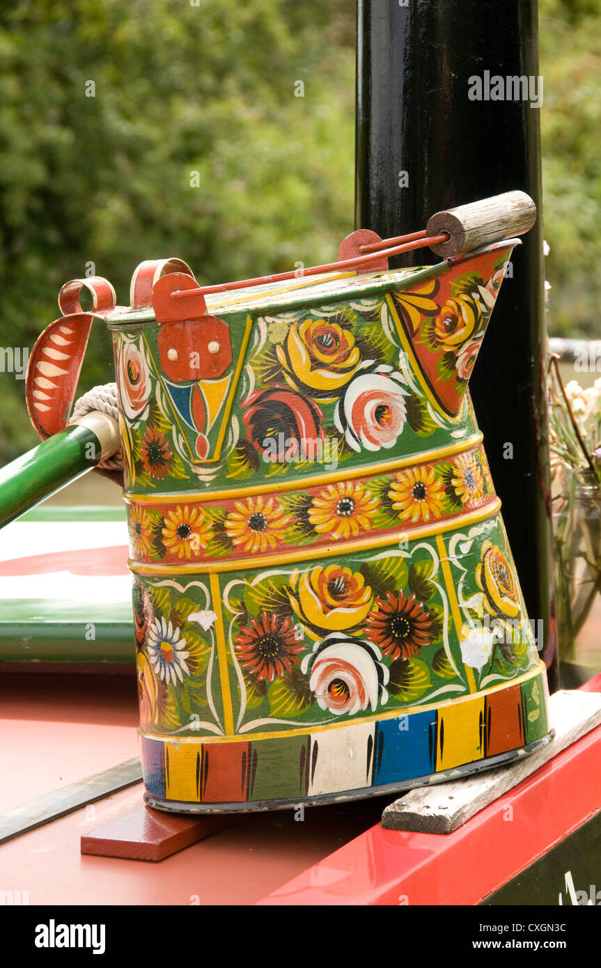 A brightly painted narrowboat water can Stock Photo - Alamy