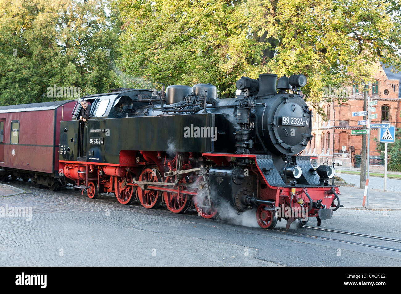 Steam locomotive pulling a passenger train. The Molli bahn at Bad ...
