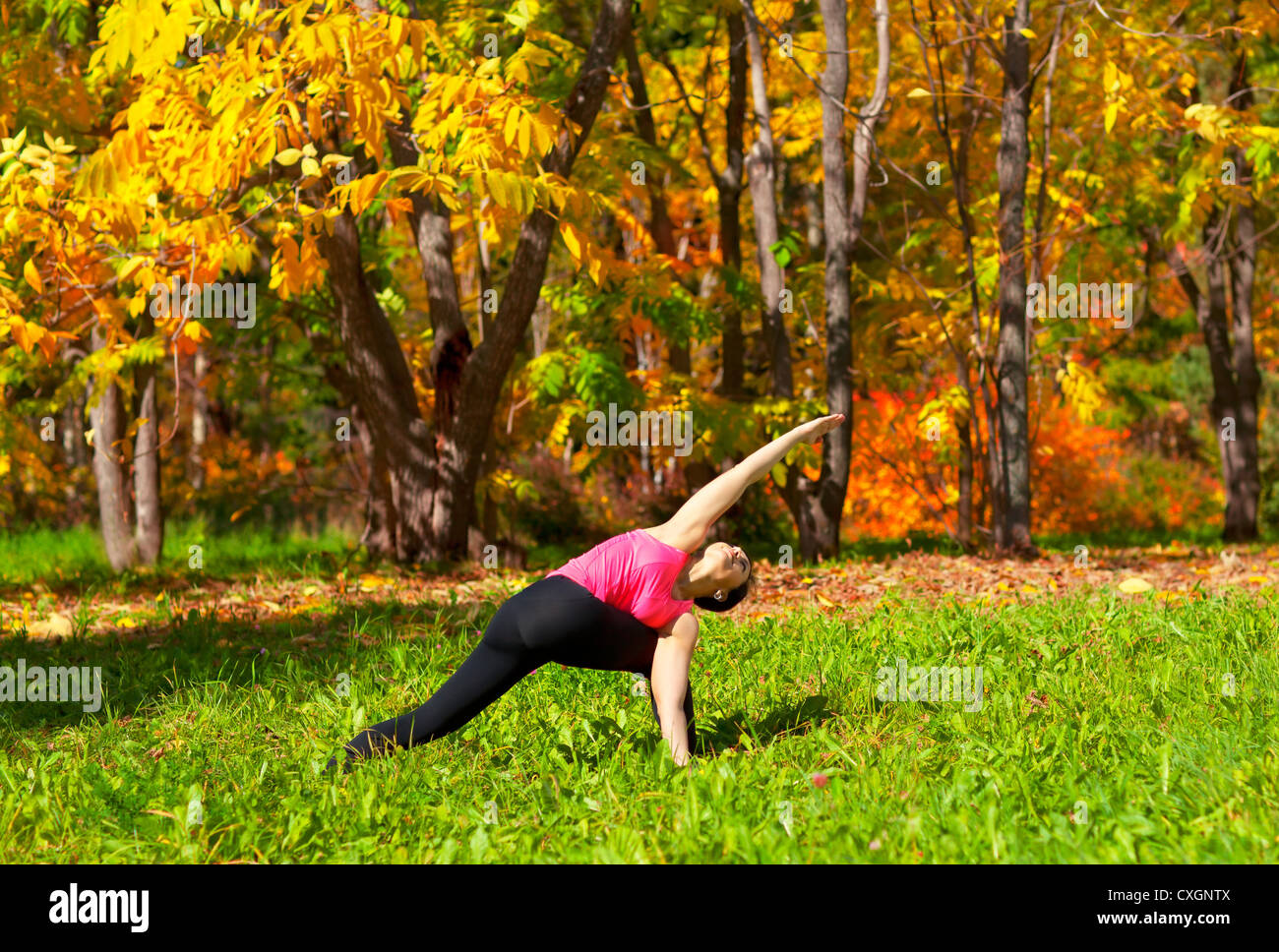 Yoga parivrita parshvakonasana pose Stock Photo - Alamy