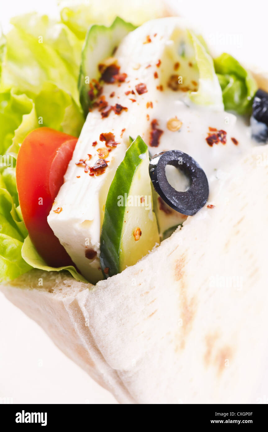 Pita stuffed with feta and vegetables Stock Photo - Alamy